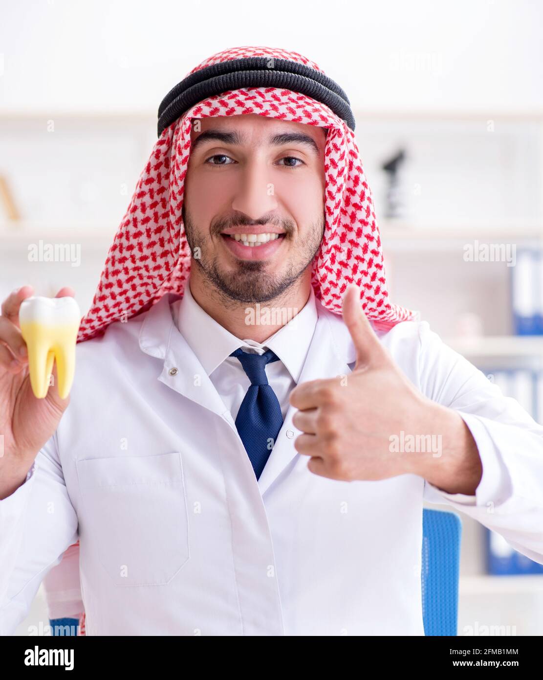 The arab dentist working on new teeth implant Stock Photo - Alamy