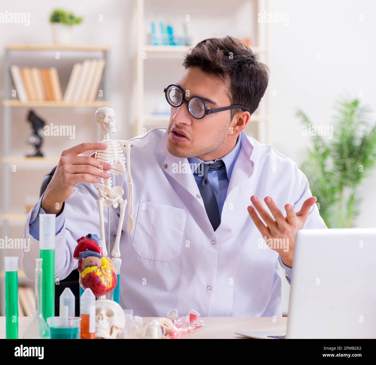 The funny doctor having fun in hospital lab Stock Photo - Alamy