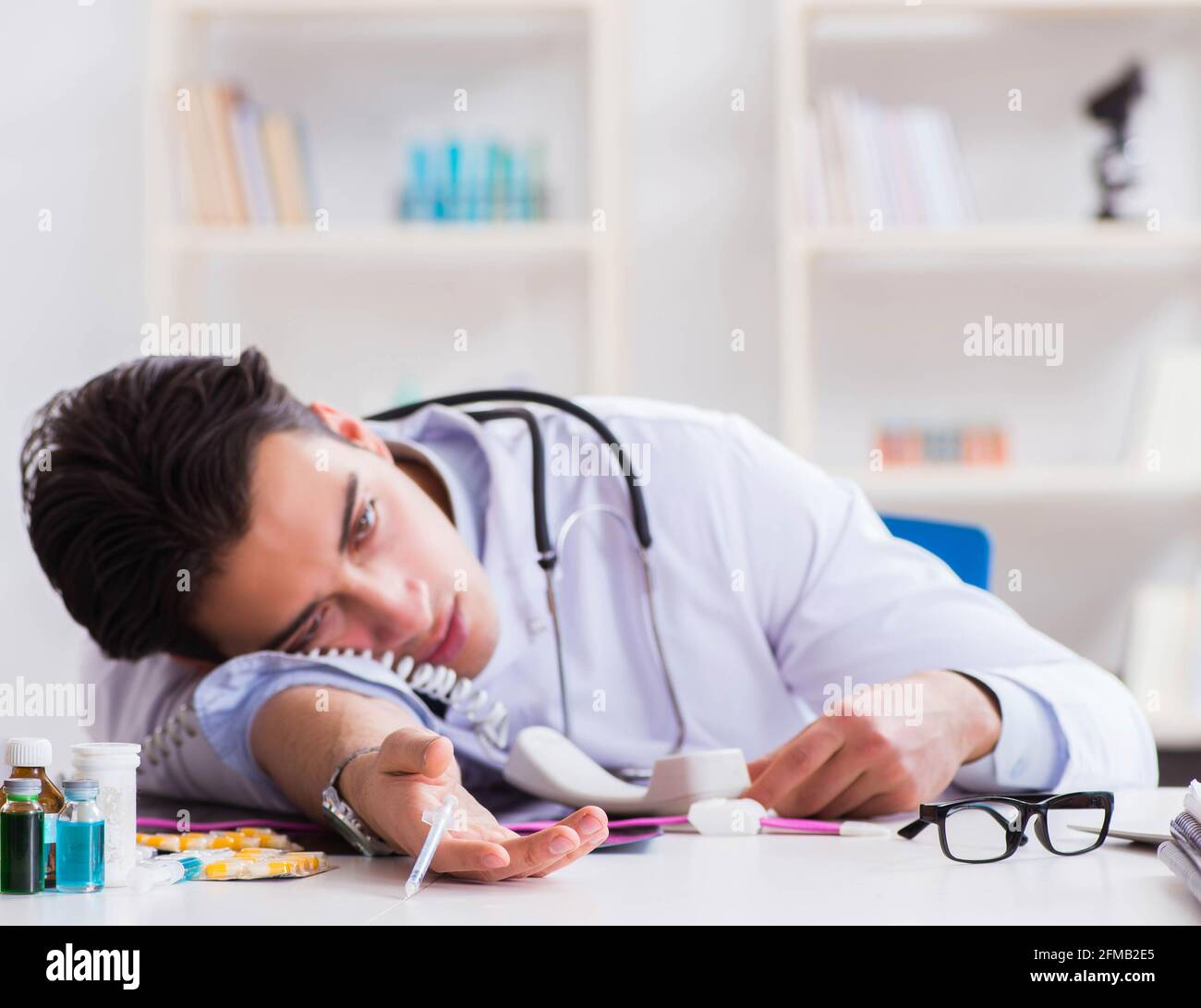 The doctor drug addict in the hospital Stock Photo - Alamy