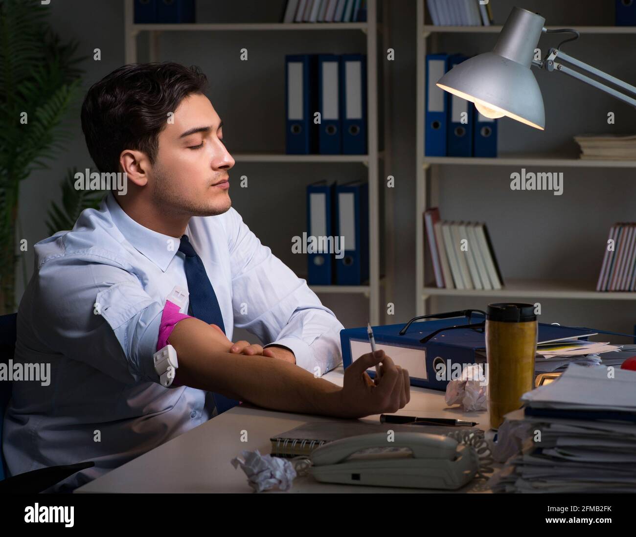 The employee relieving stress from overtime with drugs narcotics Stock ...