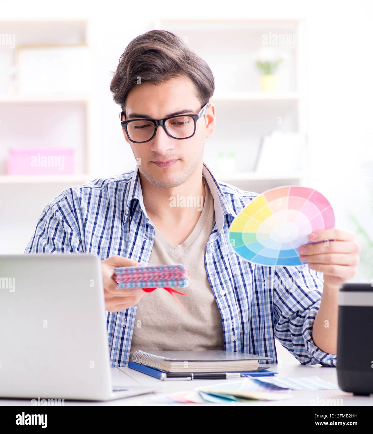 The young designer choosing colours for new project Stock Photo - Alamy
