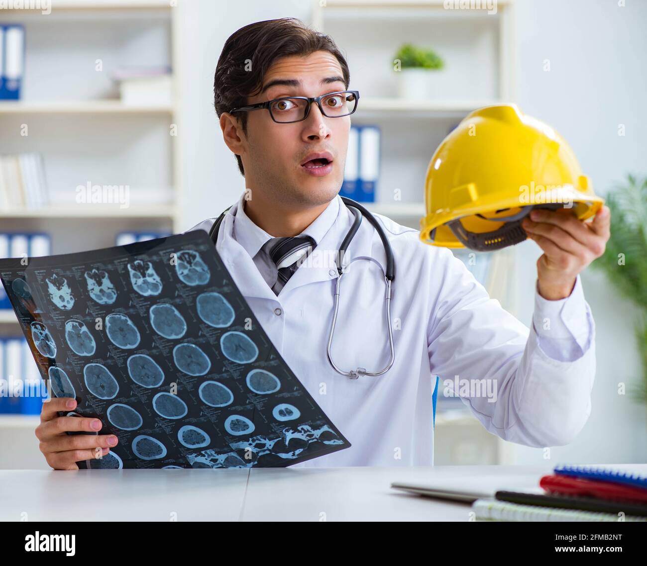 The safety doctor advising about wearing hard hat Stock Photo - Alamy