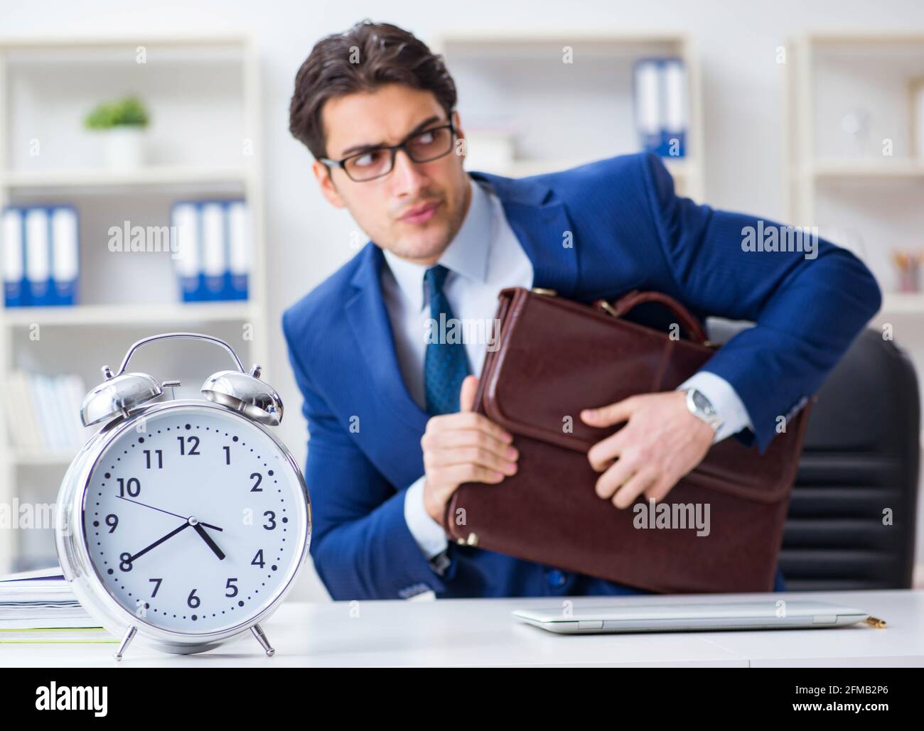 The businessman in bad time management concept Stock Photo - Alamy