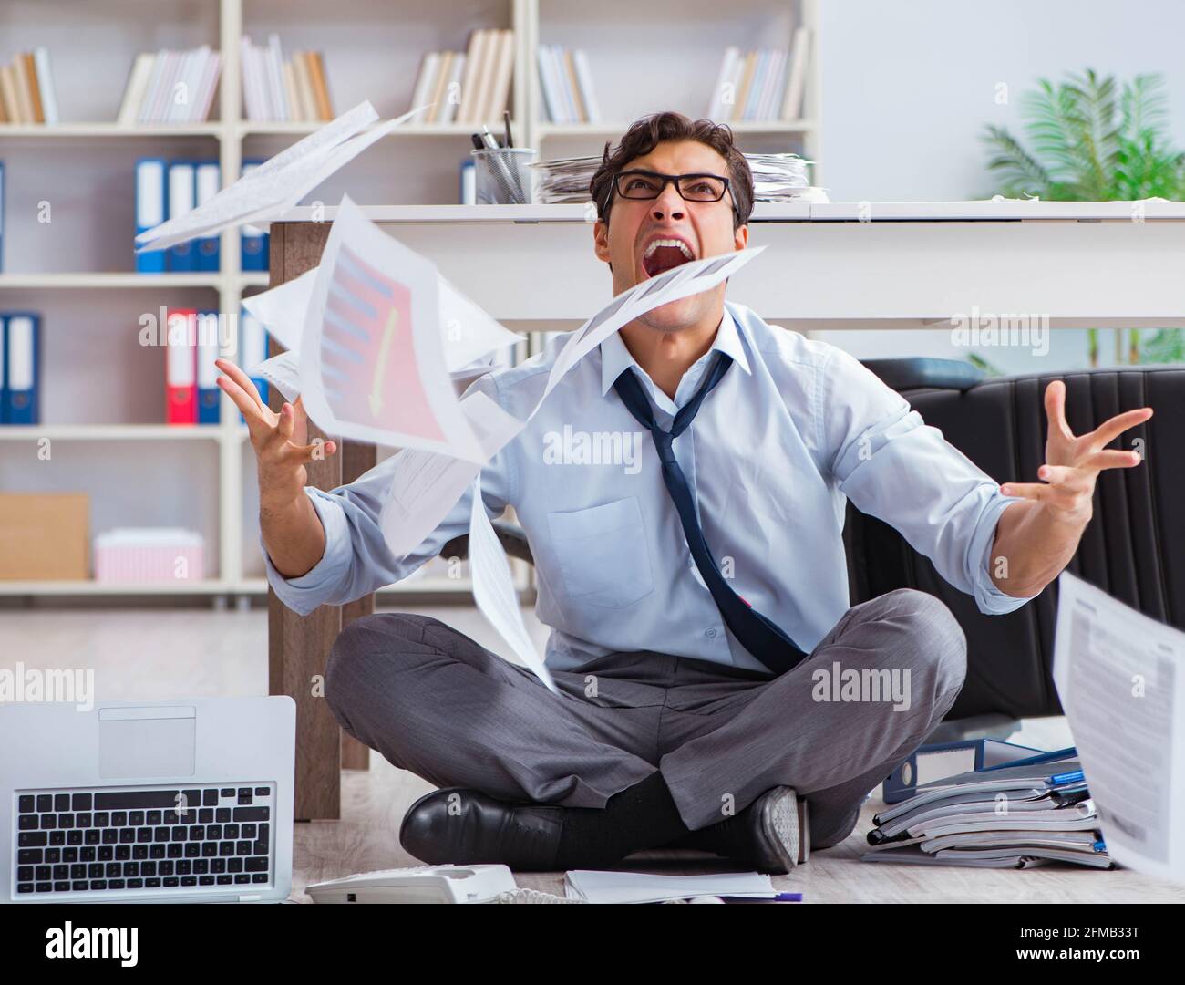 The bankrupt businessman angry in the office floor Stock Photo - Alamy