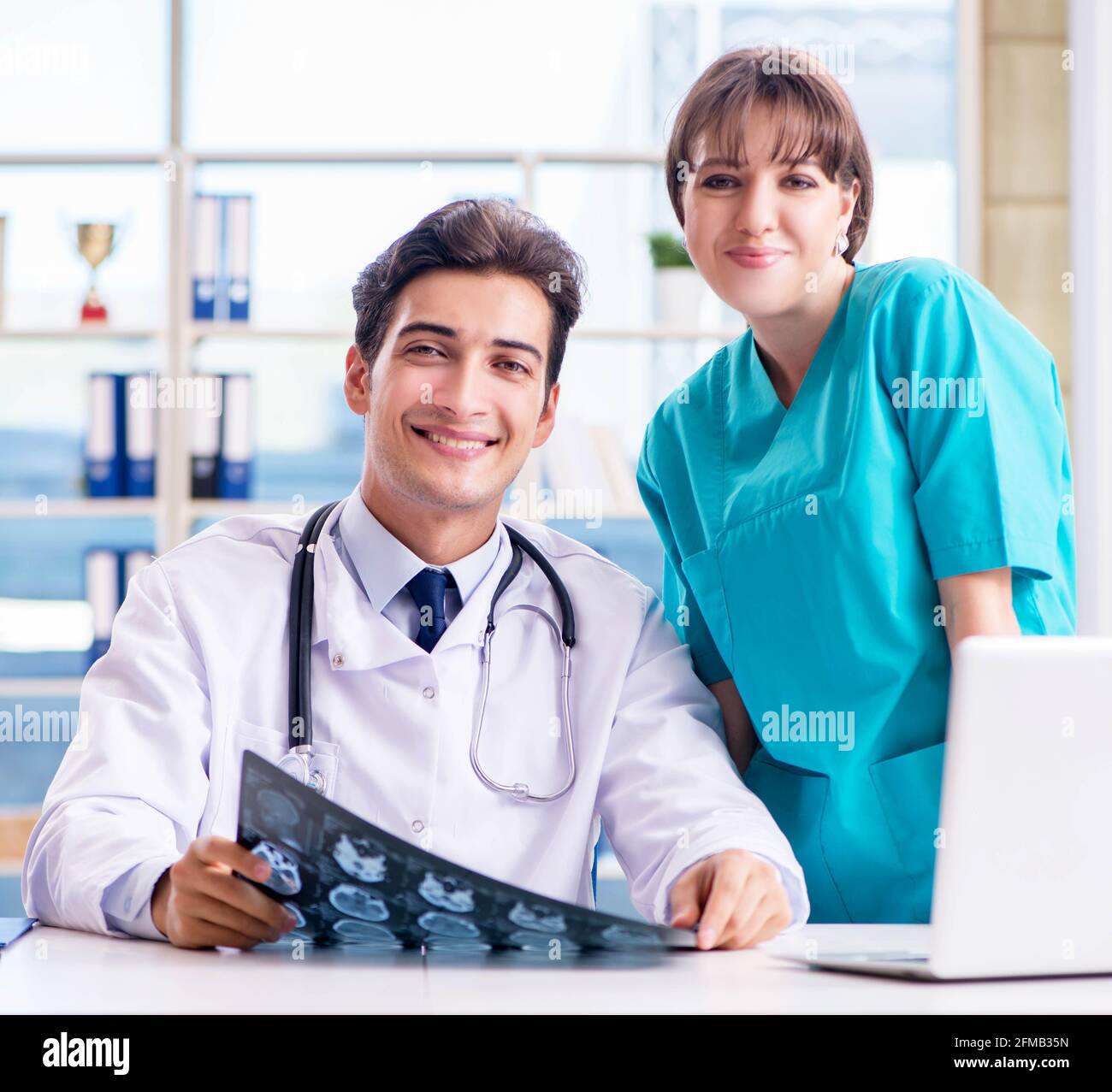 Doctors having medical discussion radiography hi-res stock photography ...