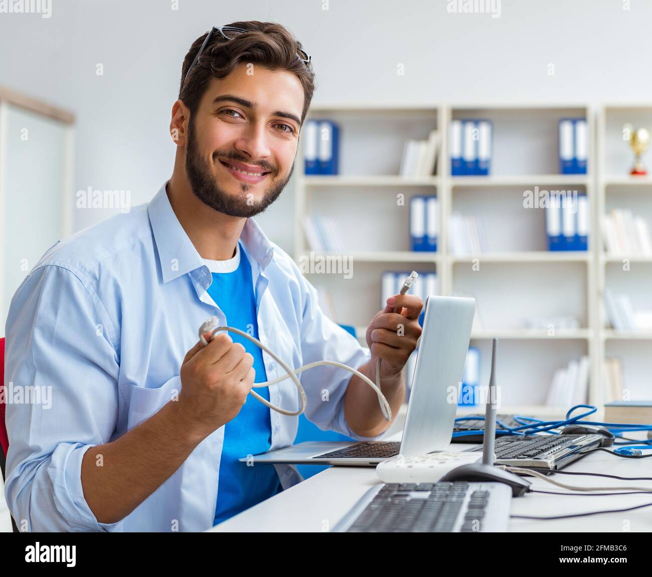 The it technician looking at it equipment Stock Photo - Alamy