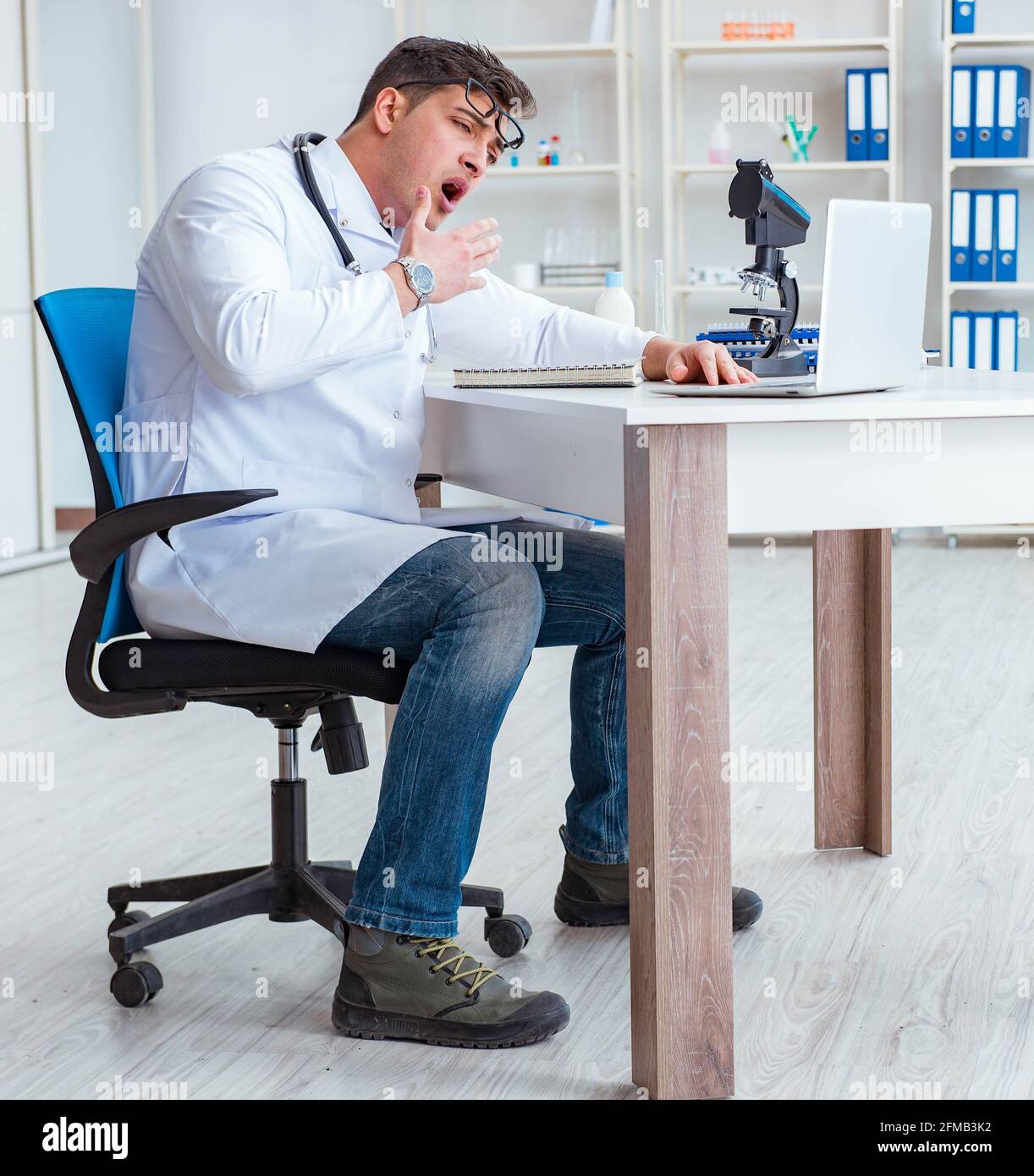 Patient yawning at doctor hi-res stock photography and images - Alamy