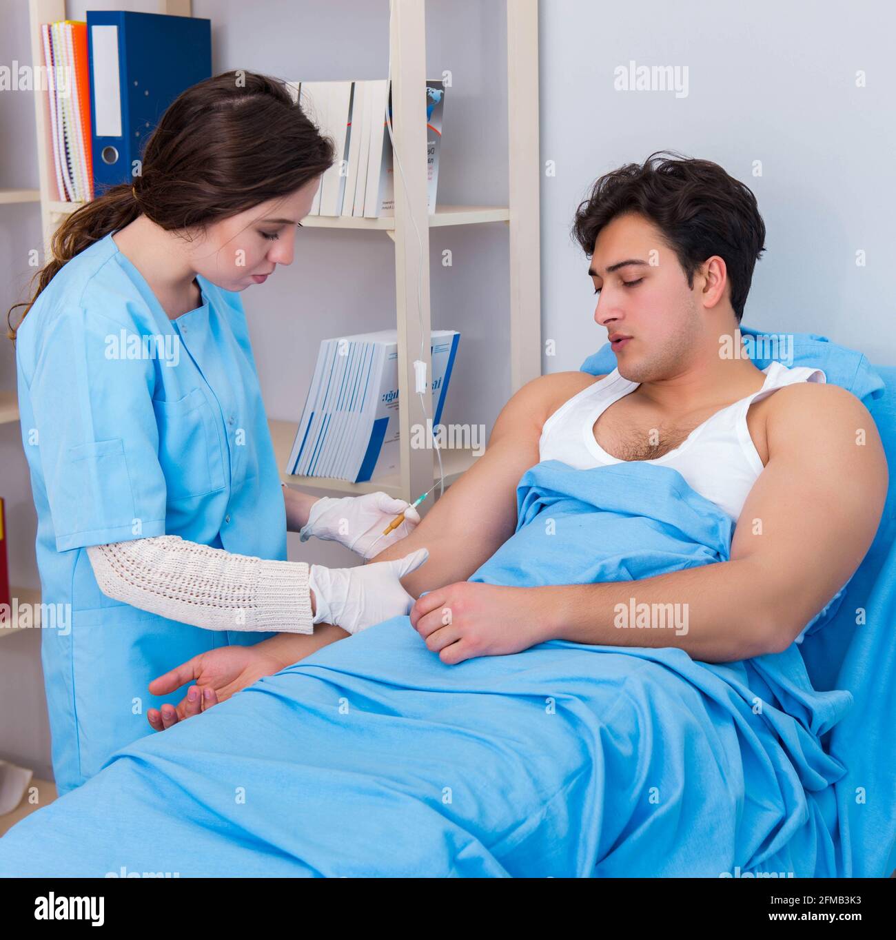 The doctor doing medical injection in hospital room Stock Photo - Alamy
