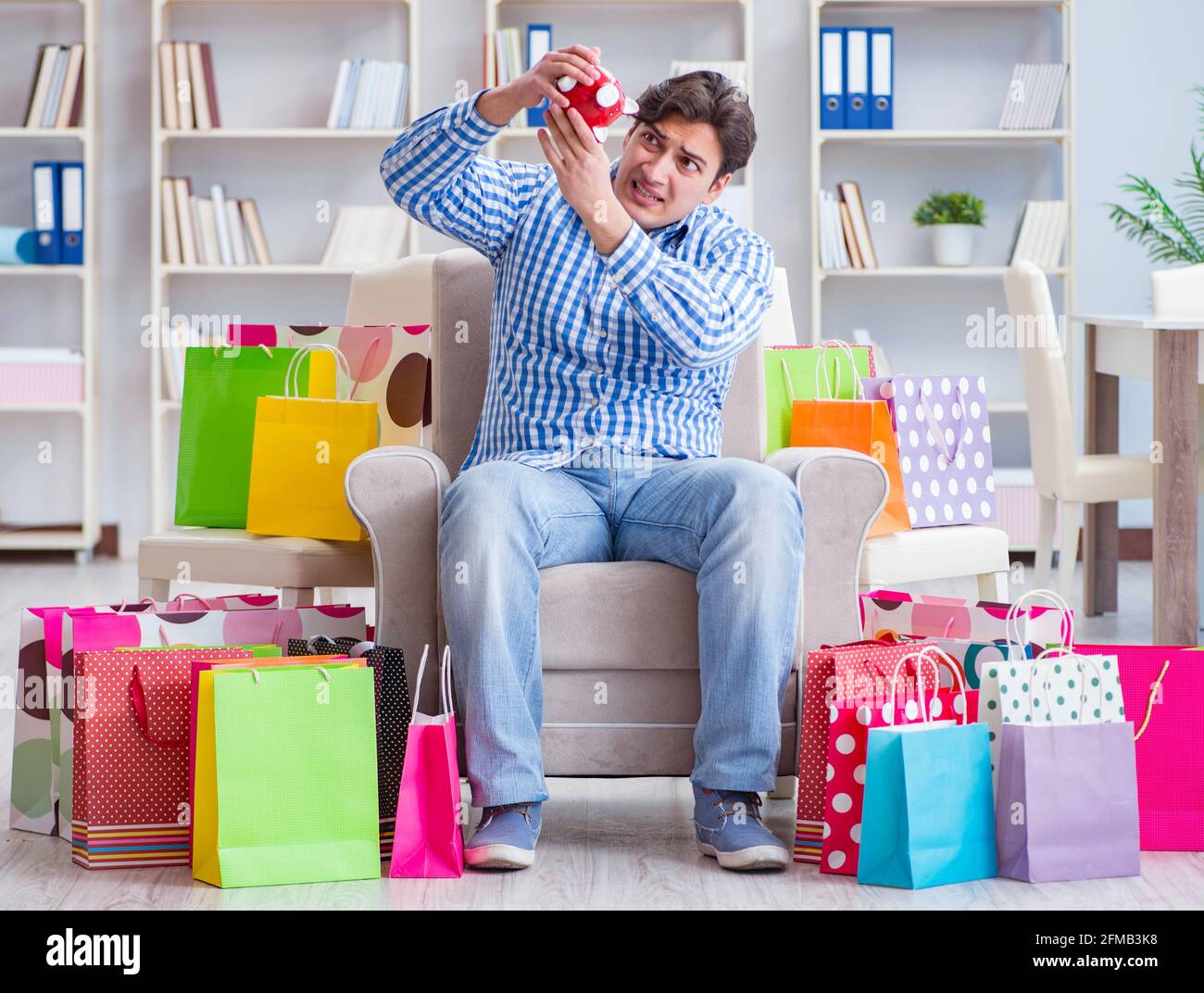 The young man after excessive shopping at home Stock Photo - Alamy