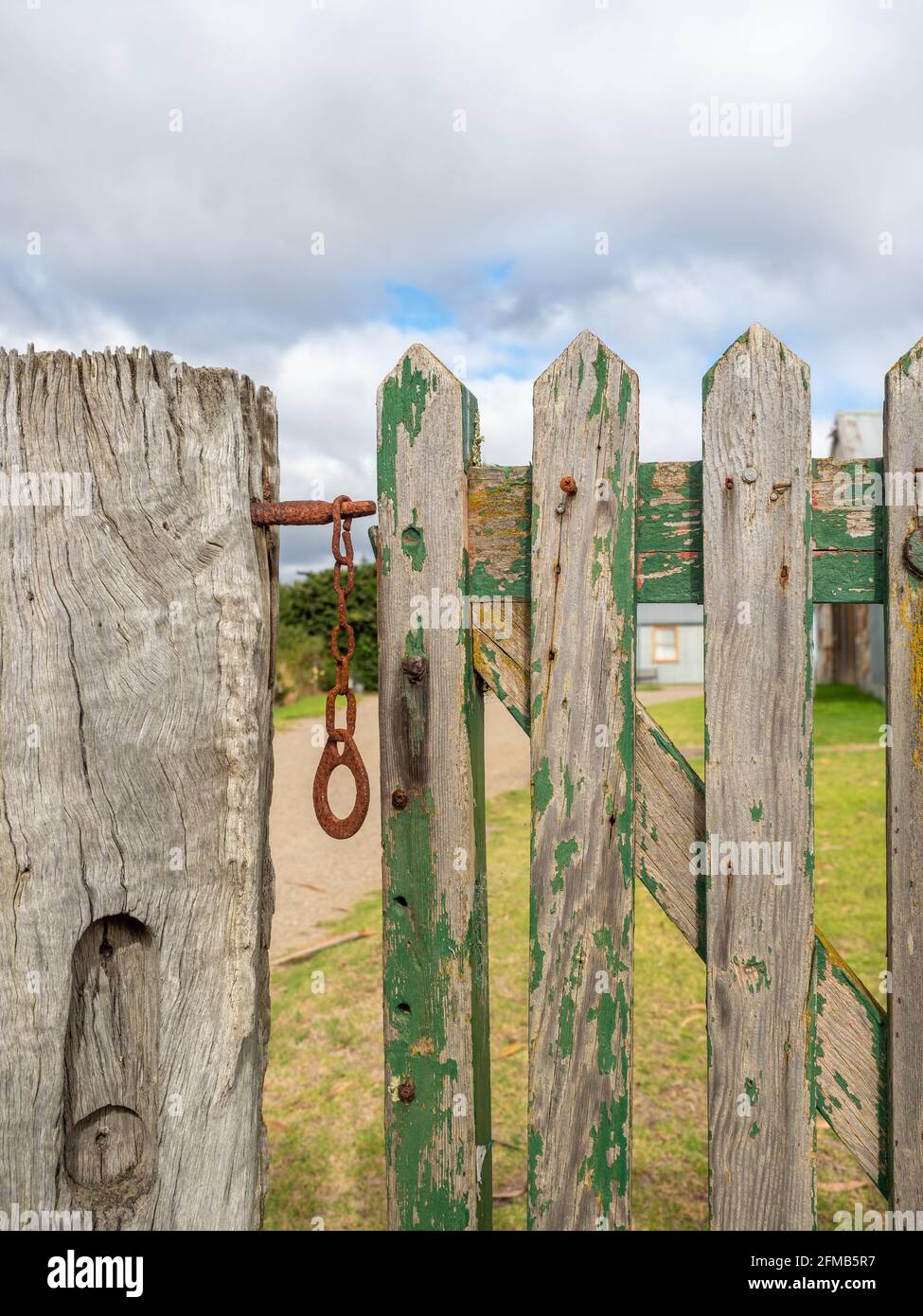 Old farm gate with the latch handing loose Stock Photo - Alamy
