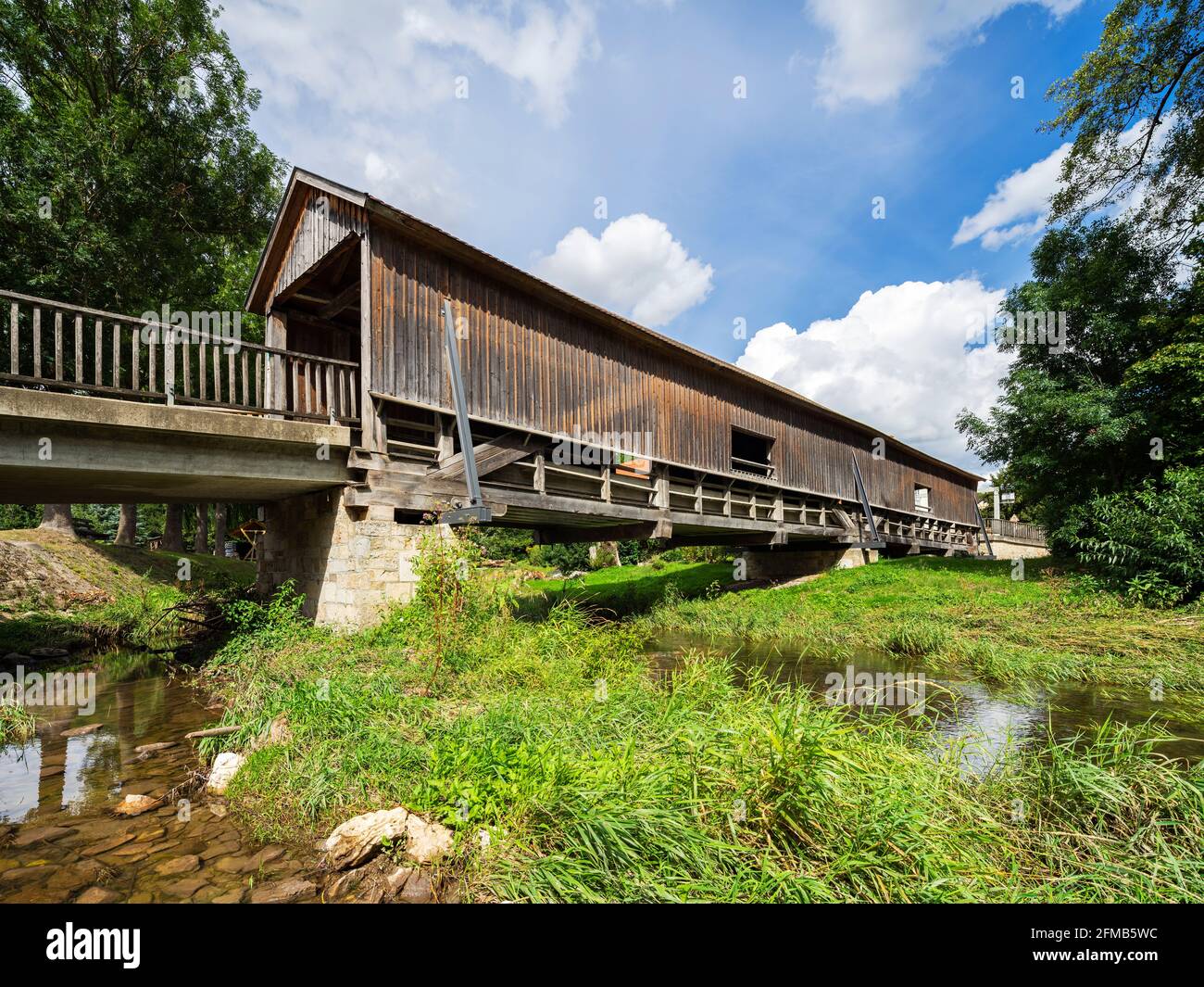 Historic covered wooden bridge over the river Ilm, Buchfart, Thuringia ...