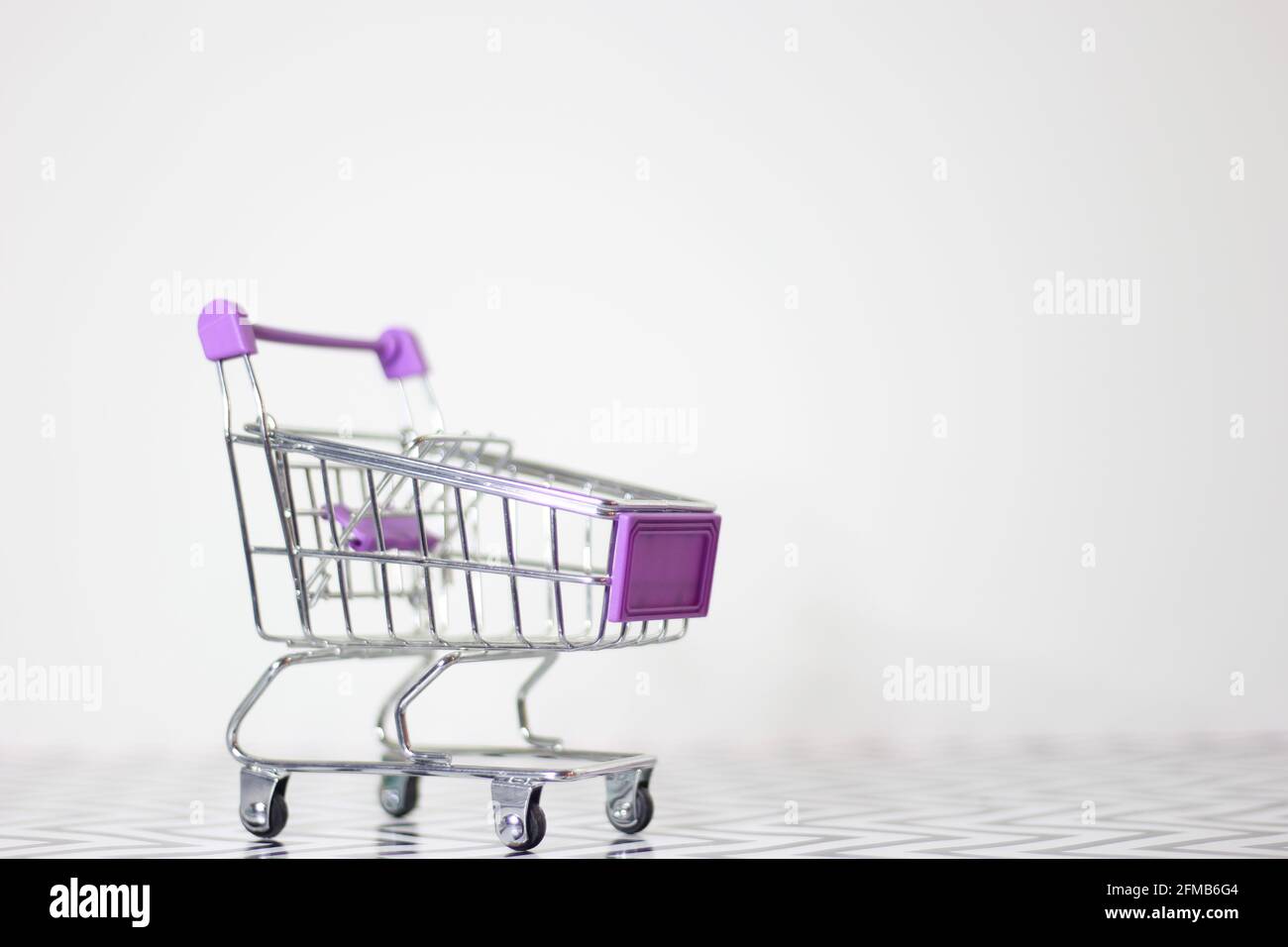 Empty Shopping Cart on Gray Background Stock Photo - Alamy