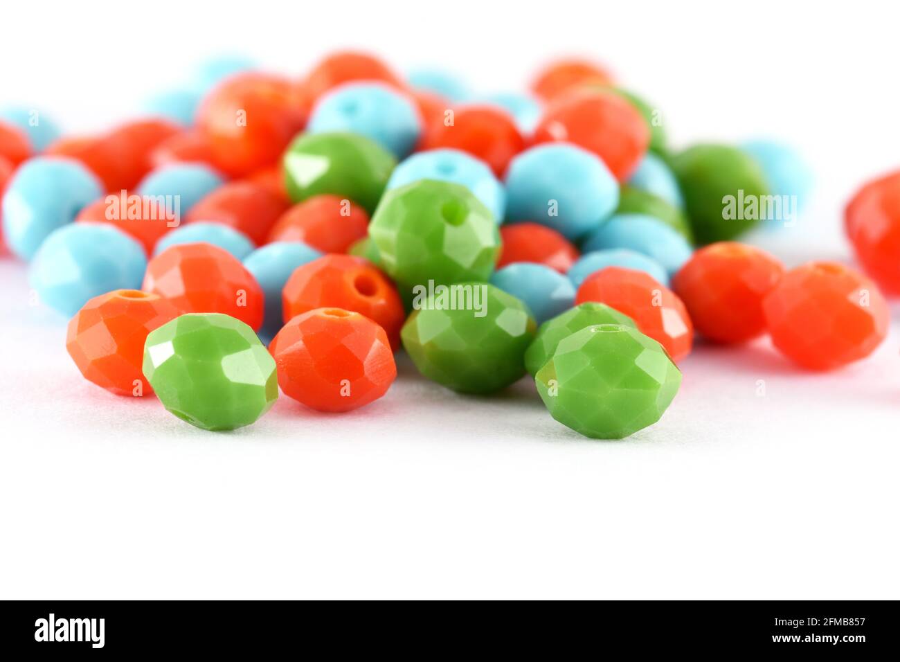 Multi color spread on white background. Background or texture of beads ...