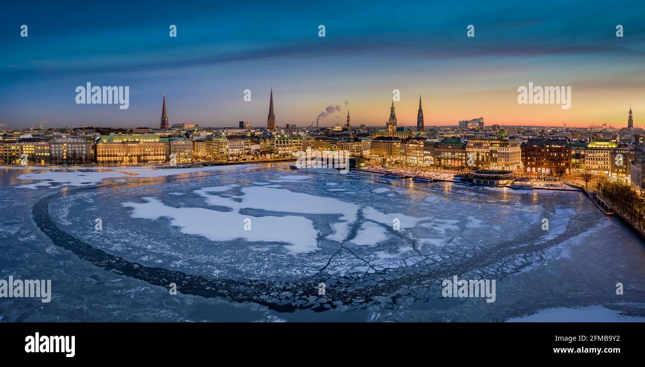 Winter sunset skyline of Hamburg, Germany with frozen Binnenalster lake ...