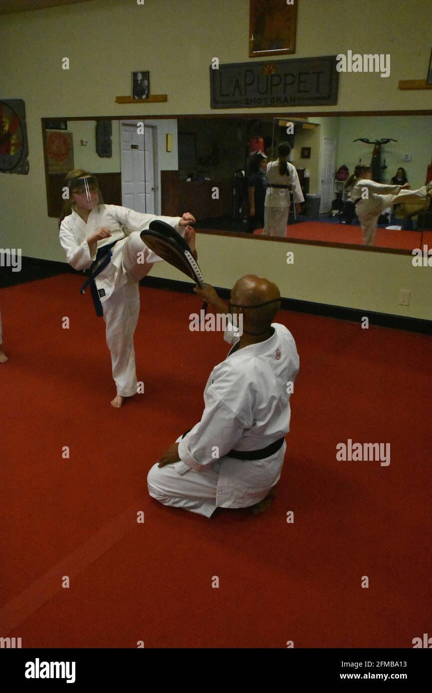 This action photo is of my daughter in her Karate class. Karate is a ...