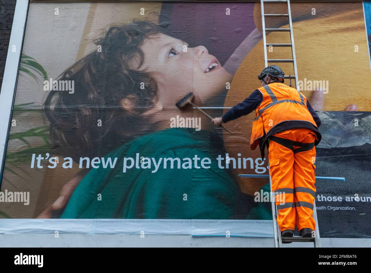 Putting Up Posters High Resolution Stock Photography and Images - Alamy