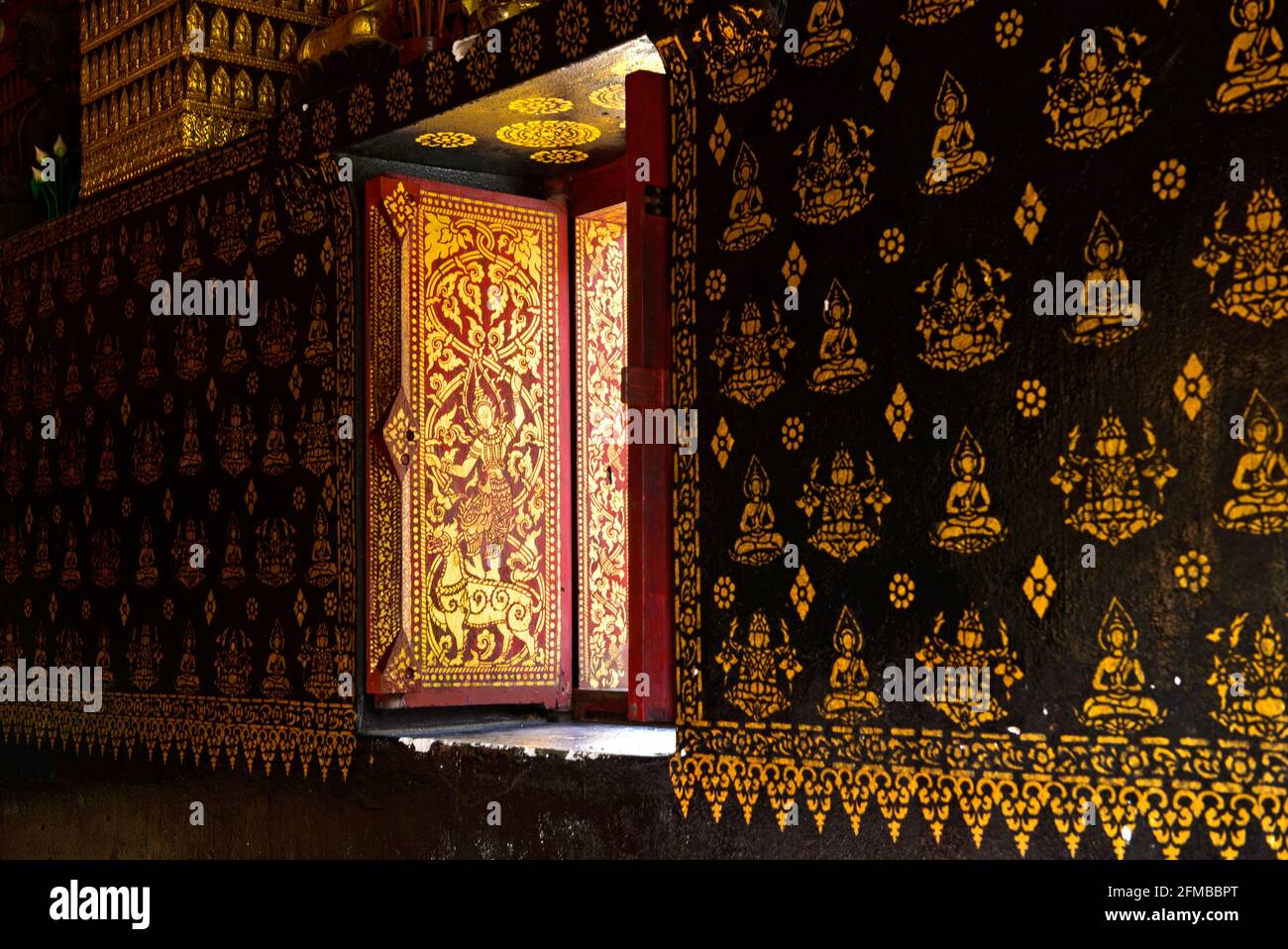 Shutter decorated with gold-colored stencil work, Wat Xieng Thong ...