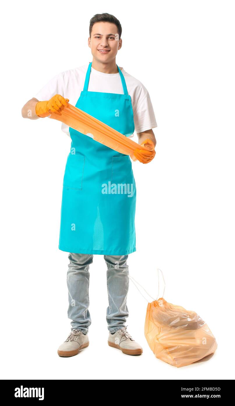 Male janitor with garbage bags on white background Stock Photo - Alamy