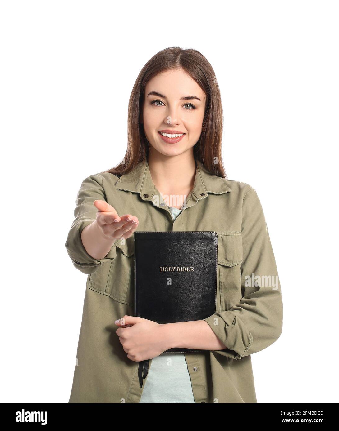 Young woman with Bible on white background Stock Photo - Alamy