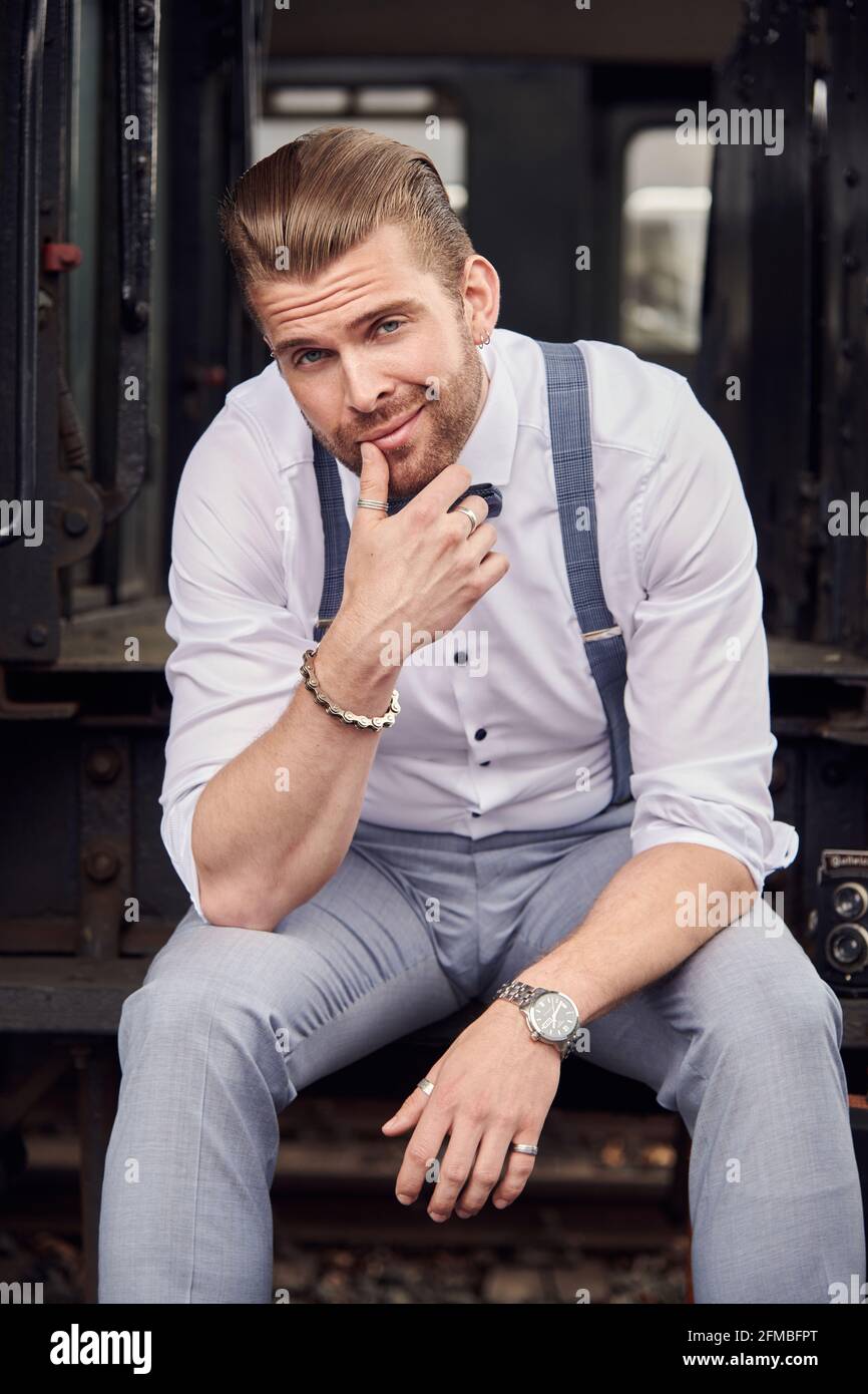 Male model with beard on old train Stock Photo - Alamy