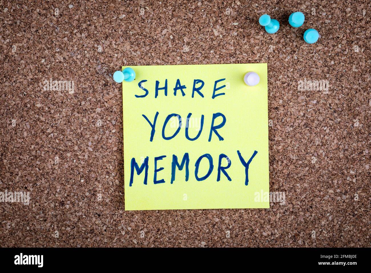 Share Your Memory. Text on a sticky note pinned to a corkboard Stock ...