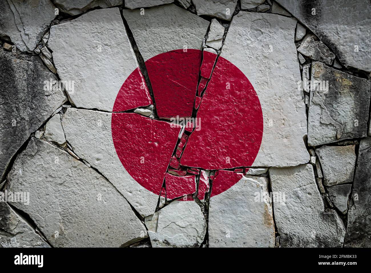 National flag of Japan depicting in paint colors on an old stone wall ...