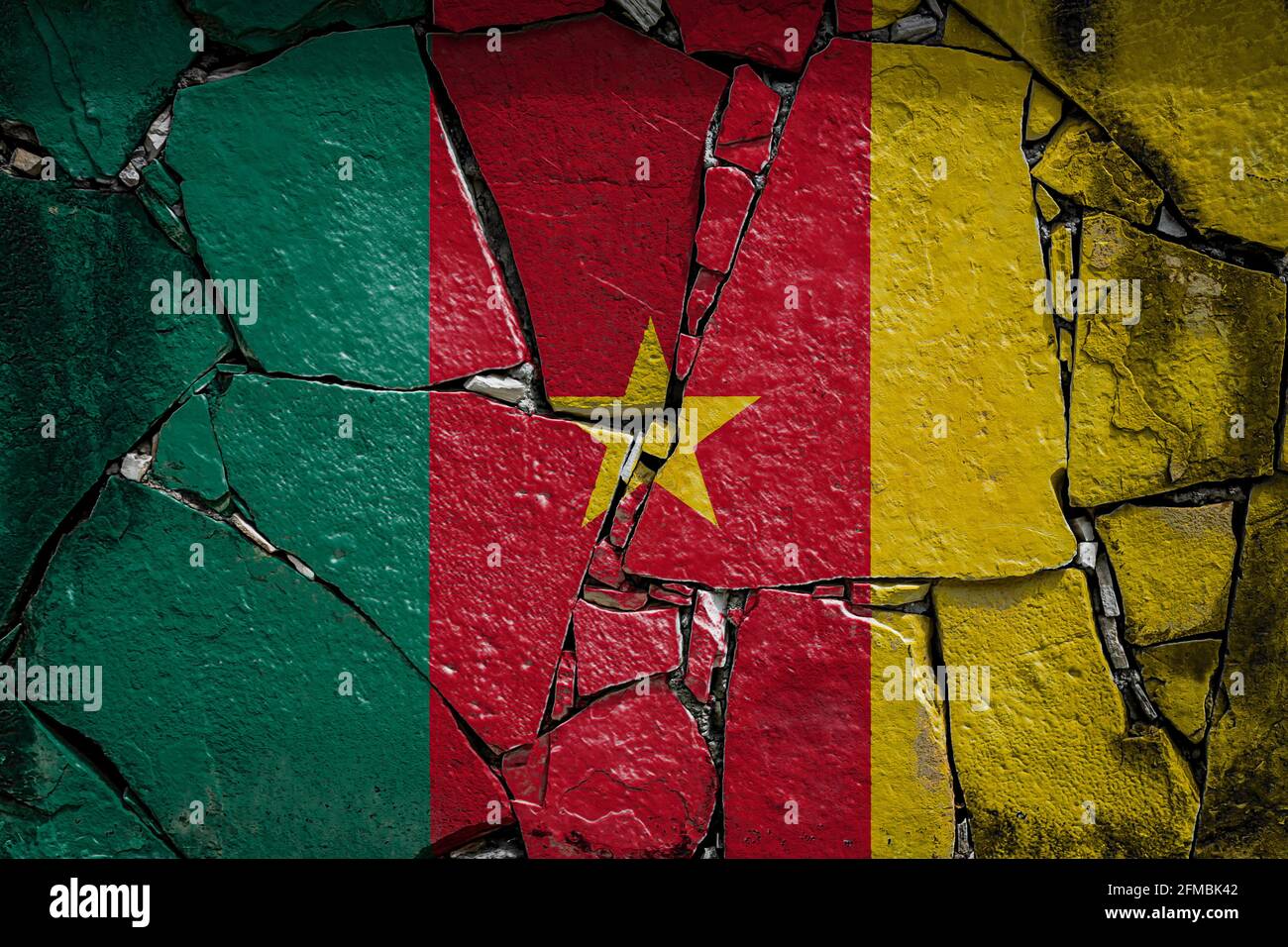 National flag of Cameroon depicting in paint colors on an old stone ...