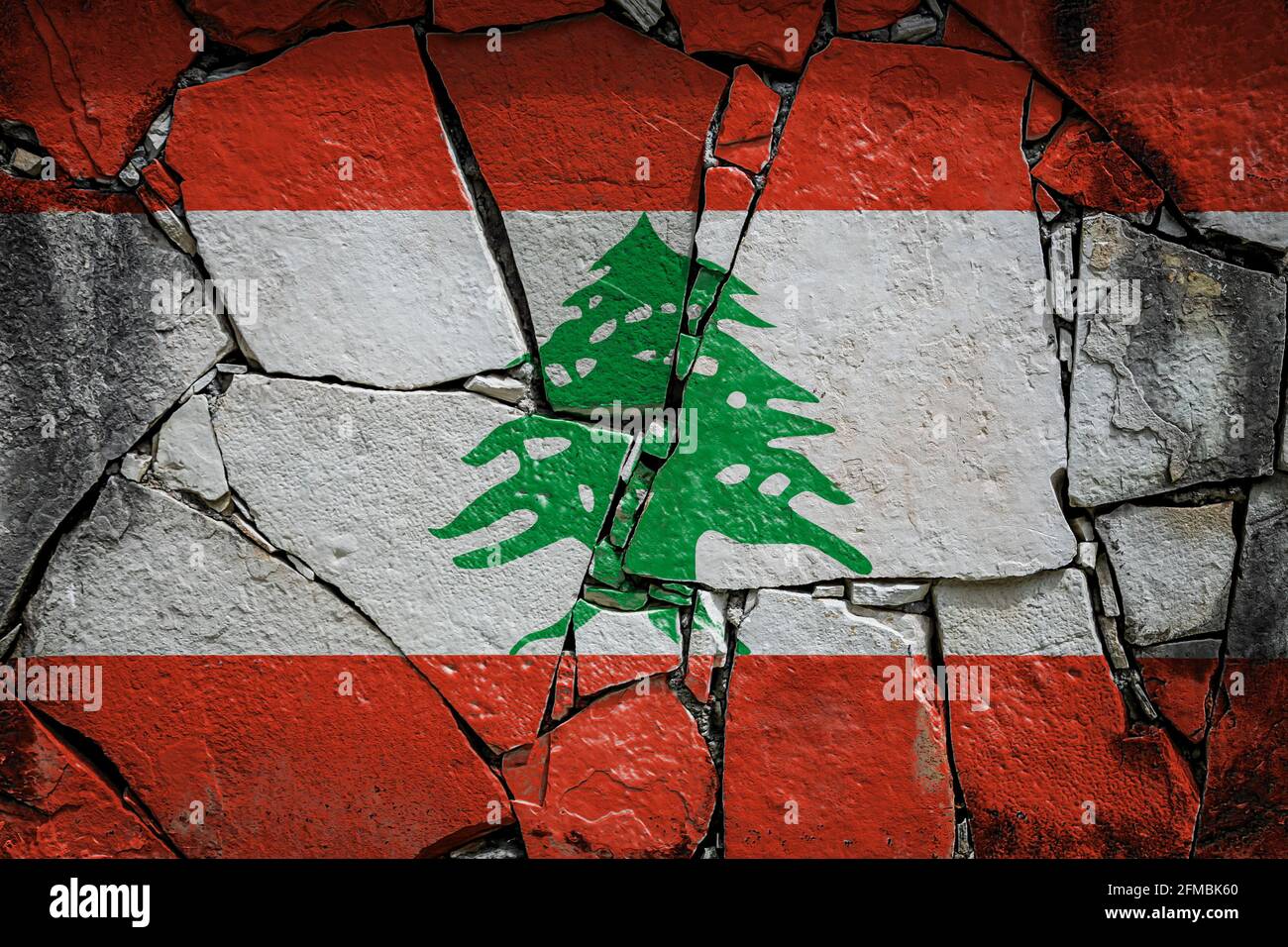 National flag of Lebanon depicting in paint colors on an old stone wall ...