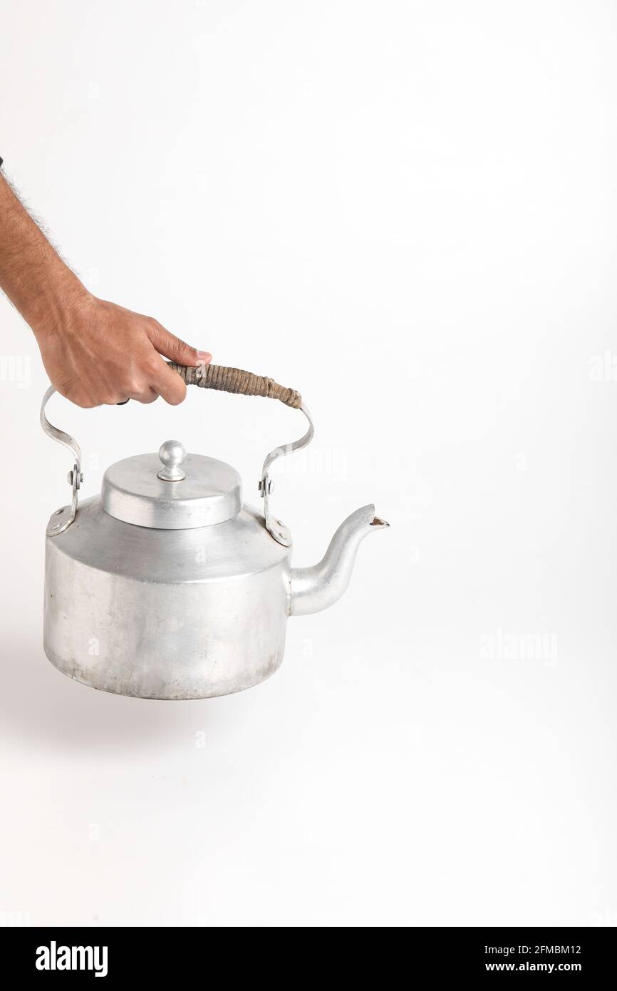 Aluminum tea kettle or tea pot on white background Stock Photo - Alamy