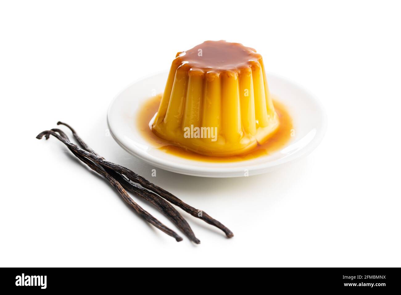 Sweet vanilla pudding and vanilla pods. Sweet dessert with caramel ...