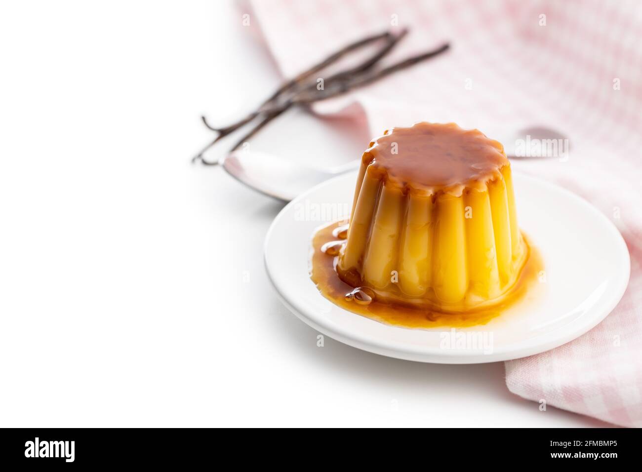 Sweet vanilla pudding. Sweet dessert with caramel topping isolated on ...