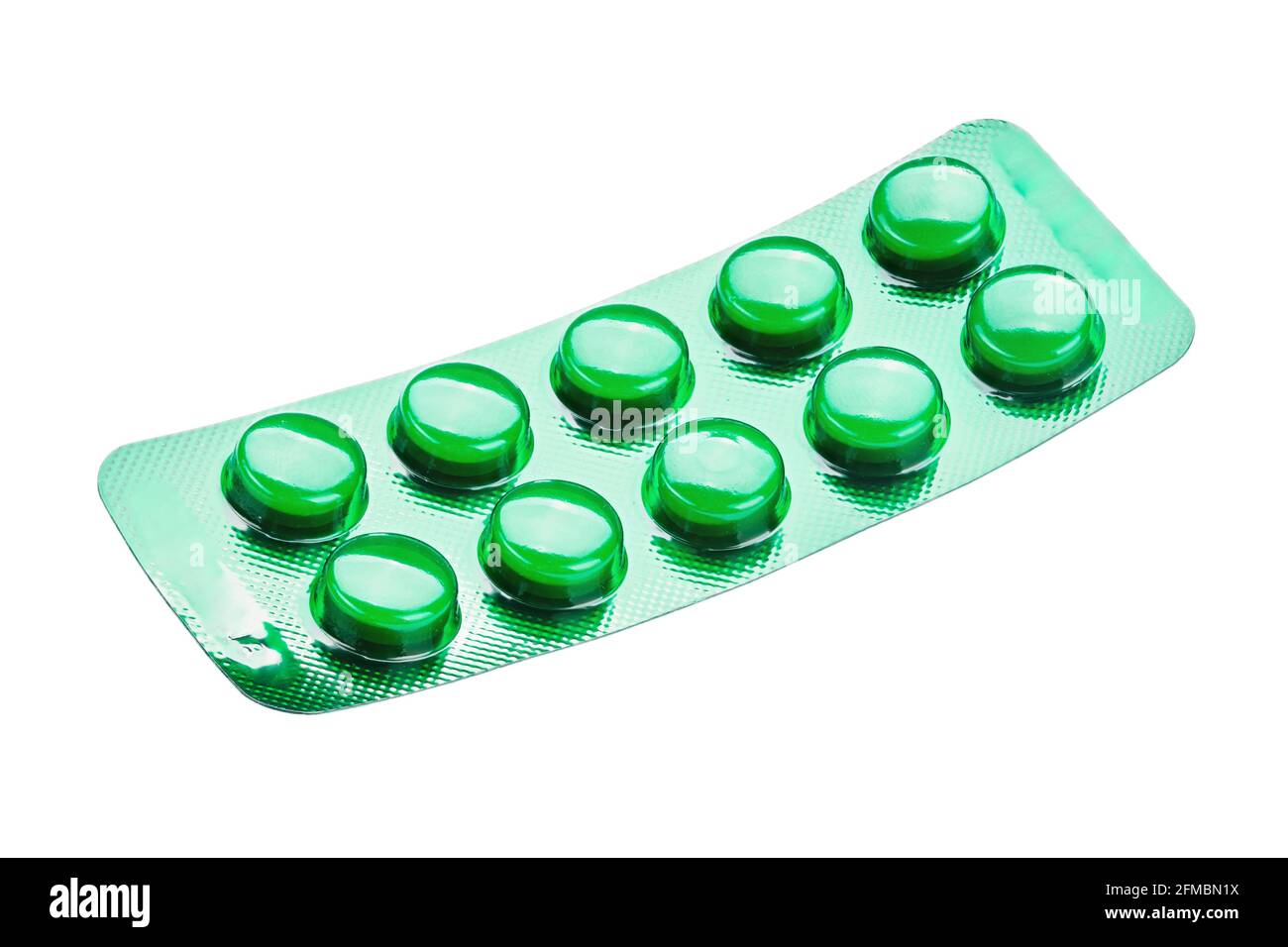 Pills in a blister pack of green color isolated on white background ...