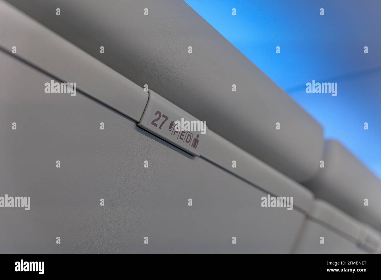 Sign of seat number with number and letter on luggage shell inside ...