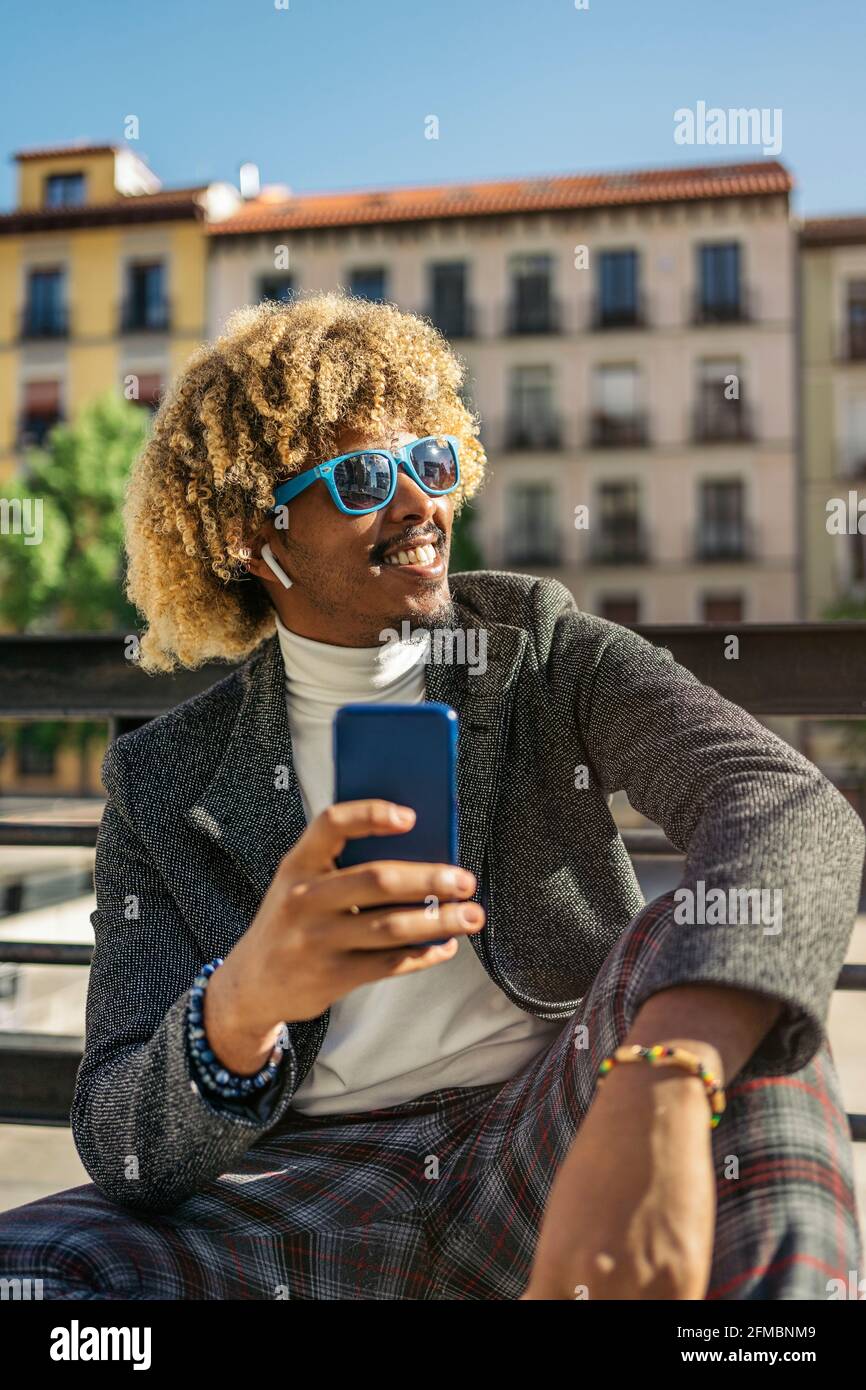 Afro man using earphones character hi-res stock photography and images - Alamy