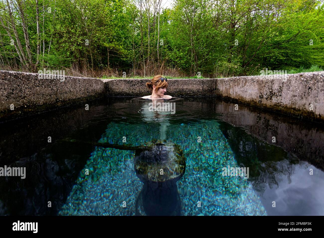 Woman relaxing in outdoor hot spring Stock Photo - Alamy