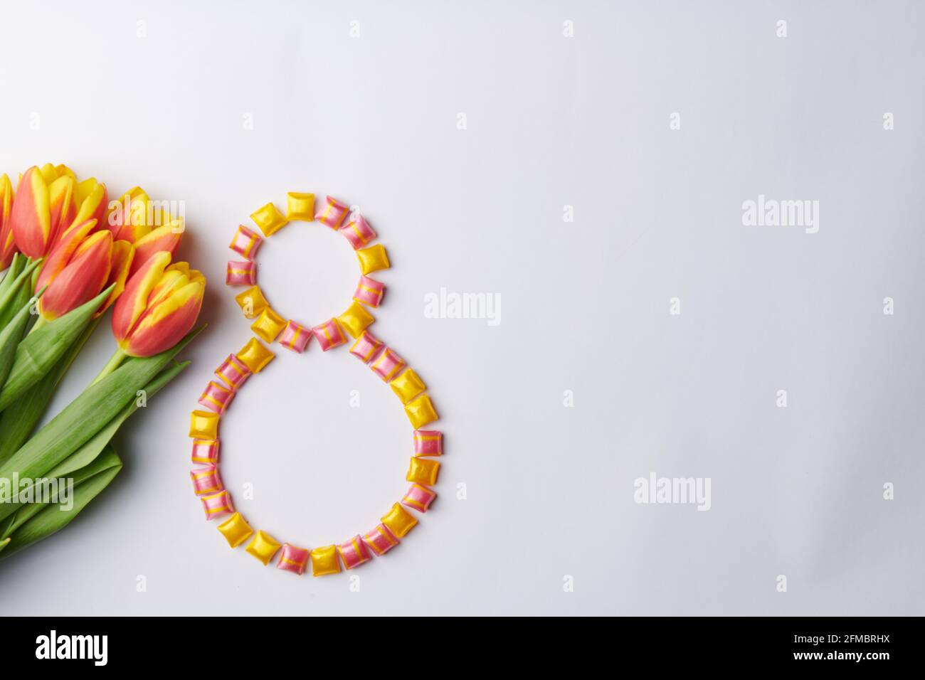 bouquet of tulips number eight made of square red-yellow candies Stock ...