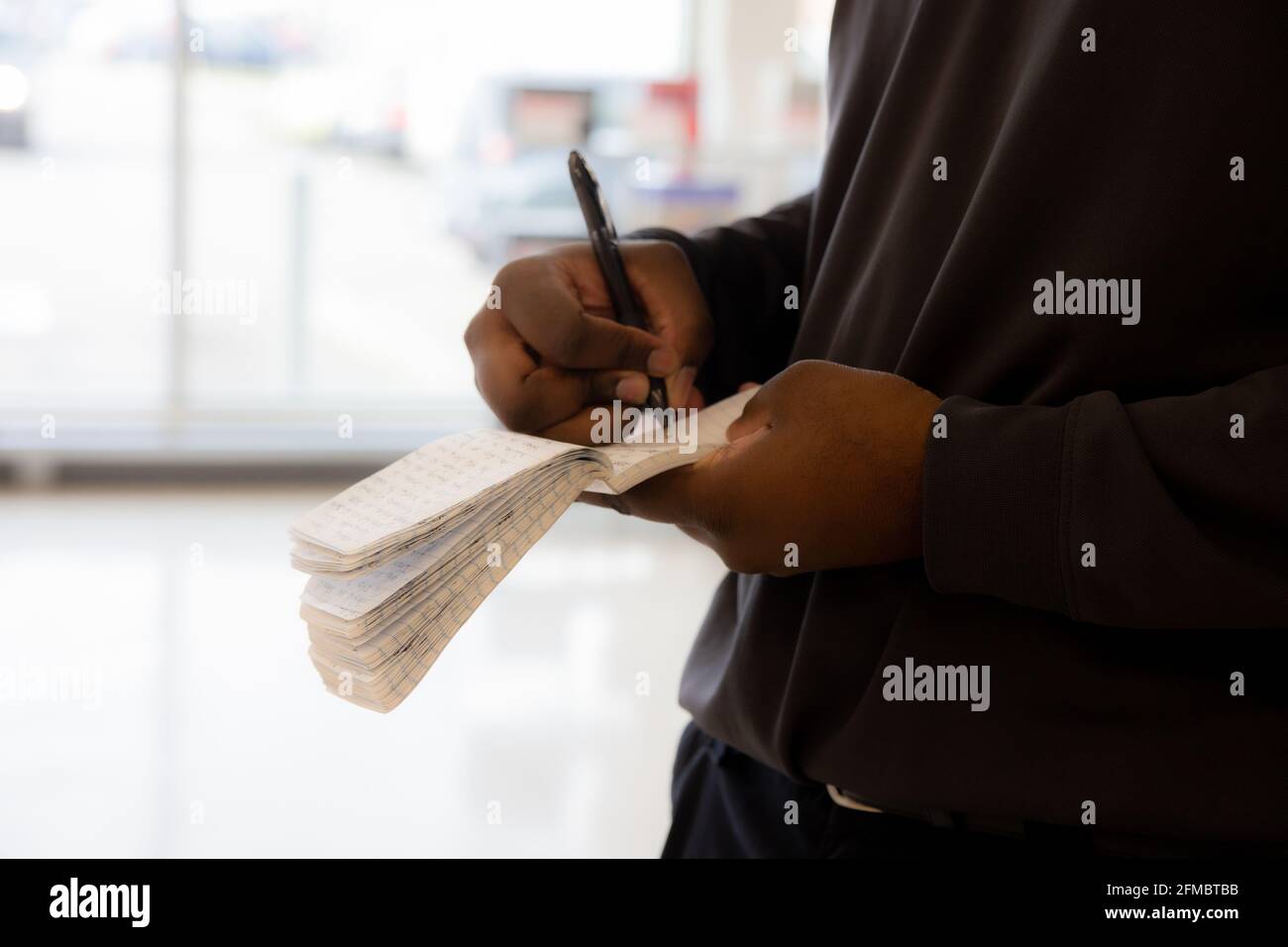 Security guard taking notes to share information with his team Stock ...