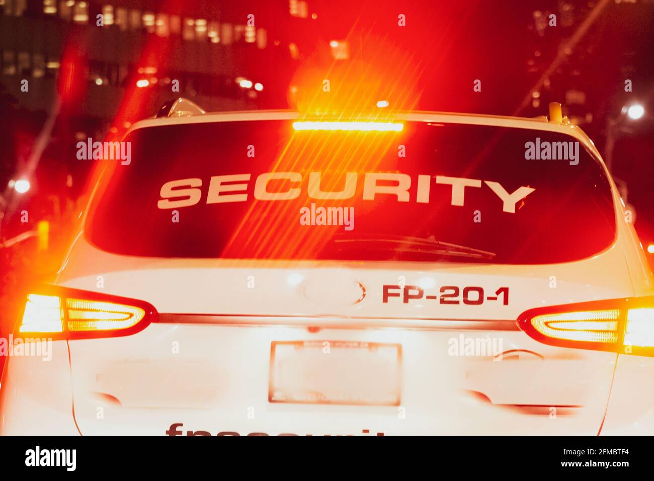 Security company car operating to patrol the city Stock Photo - Alamy
