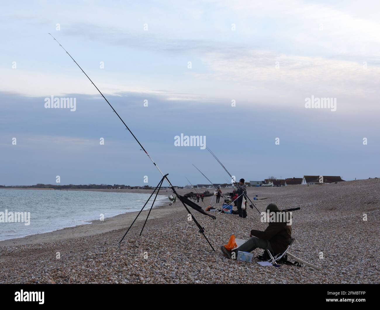 People fishing on the beach on the south coast of the UK Stock Photo ...