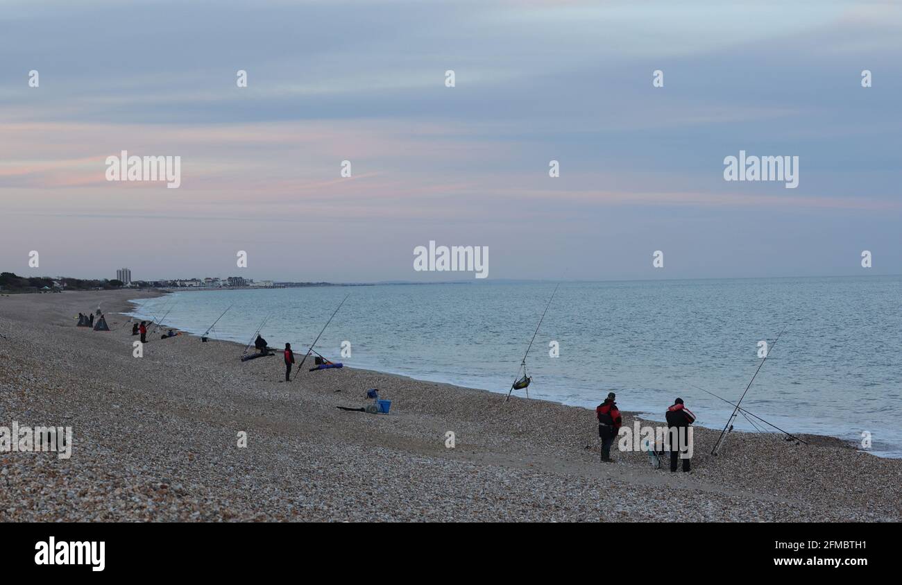 Group of people fishing on the beach of Aldwick, England, UK Stock ...
