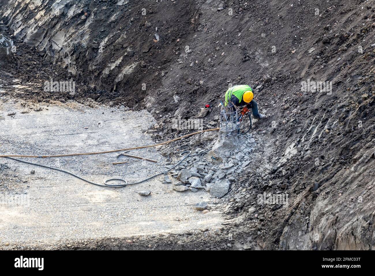 Breaking concrete reinforced pillar at construction site Stock Photo ...