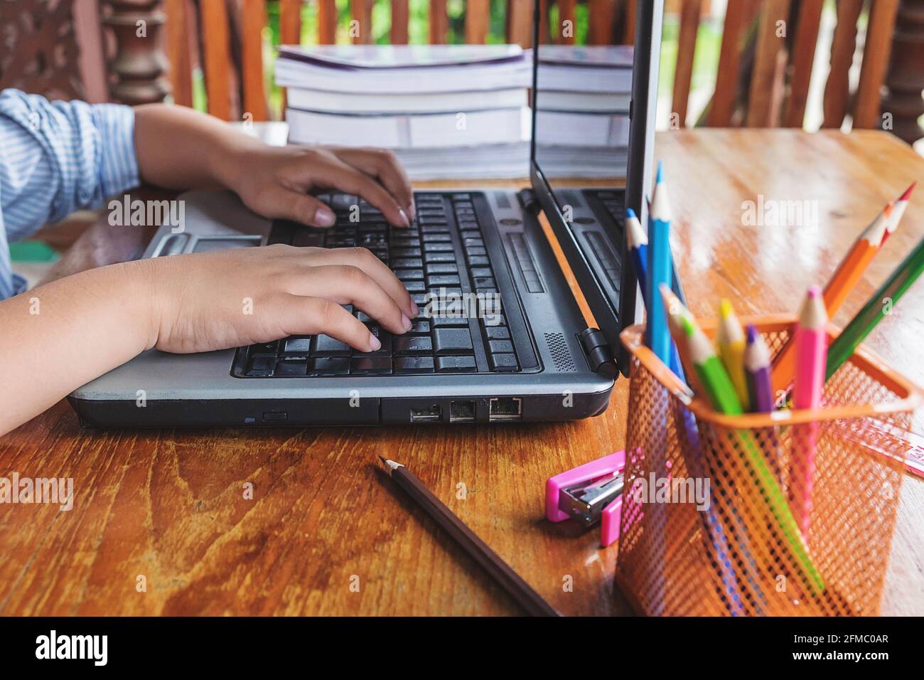 Boy learns by computer Stock Photo - Alamy
