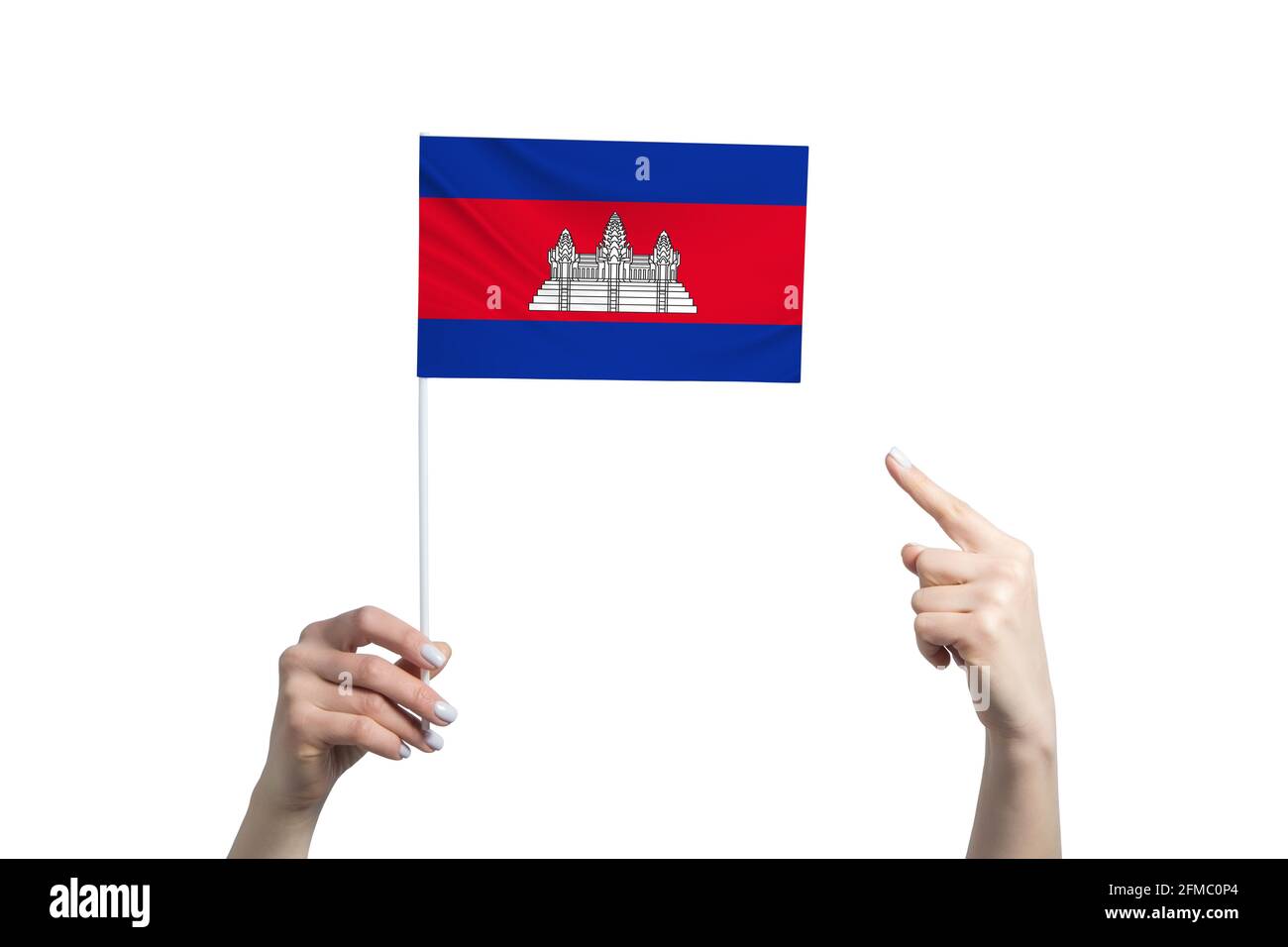 A beautiful female hand holds a Cambodia flag to which she shows the ...