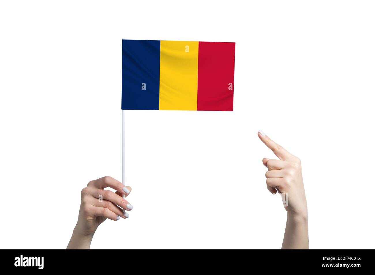 A beautiful female hand holds a Chad flag to which she shows the finger ...