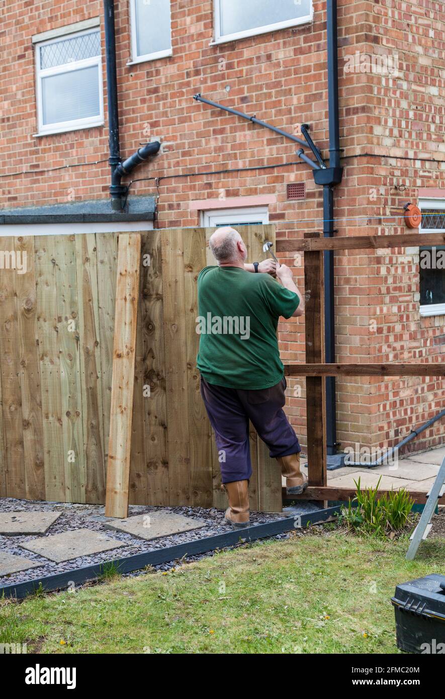 Man on fence hi-res stock photography and images - Alamy