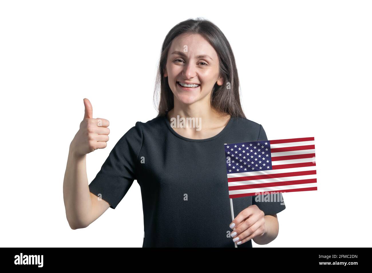 Happy young white woman holding flag of United States and shows the ...