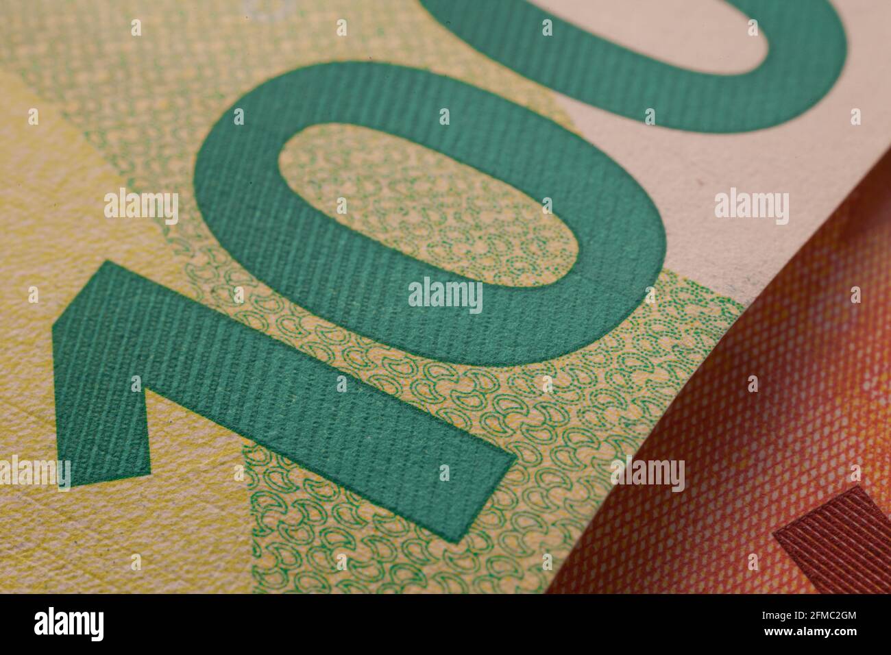 Series of macro shots of details of 100 euro bill. Security features ...