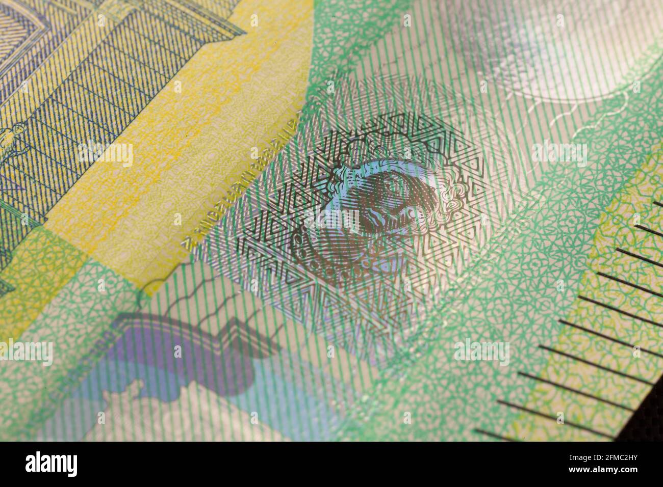 Series of macro shots of details of 100 euro bill. Security features ...