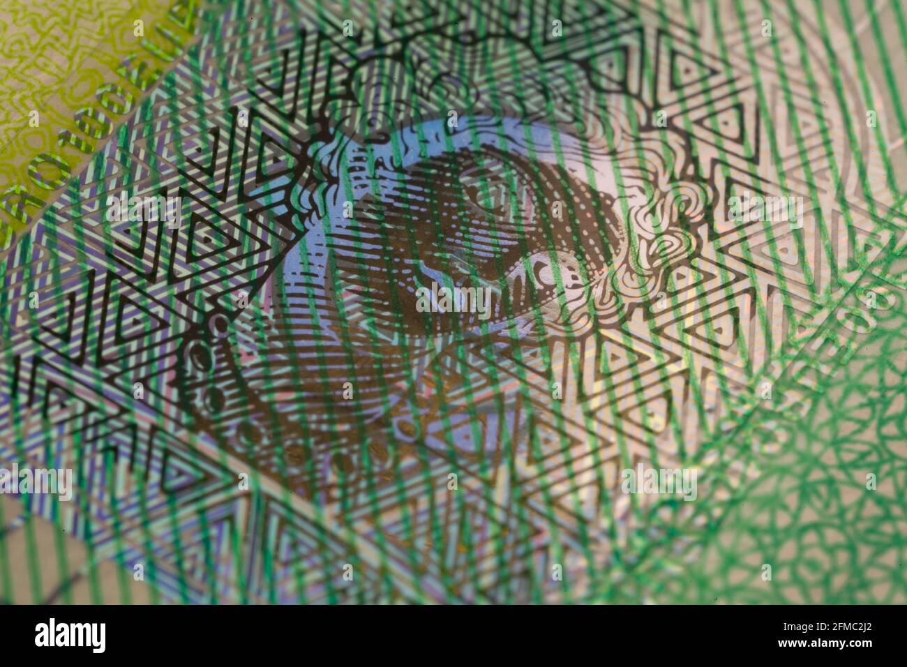 Series of macro shots of details of 100 euro bill. Security features ...