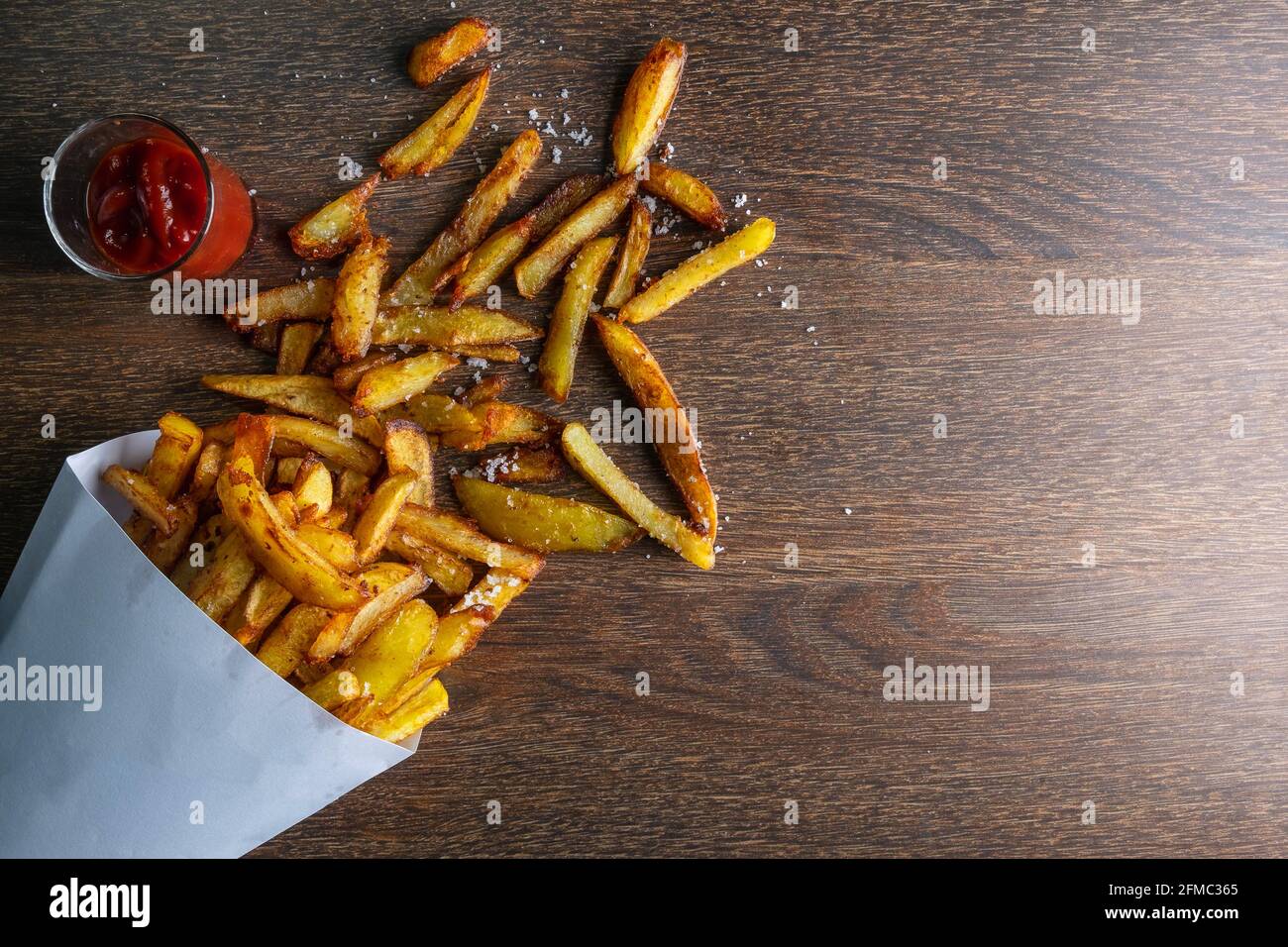 French fries in a paper bag with sauces Stock Photo - Alamy